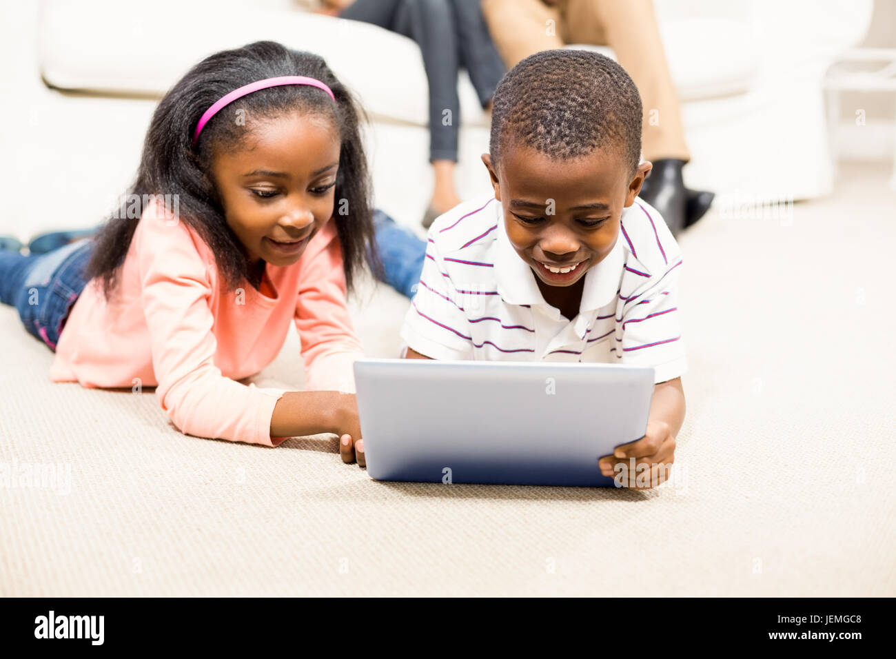 Parents sofa tablet child floor hi-res stock photography and images - Alamy