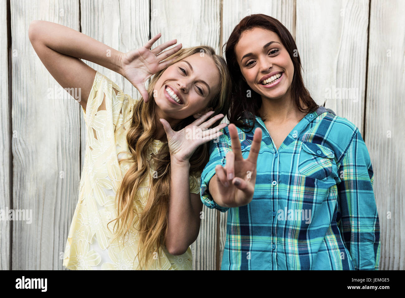 Two friends smiling at camera Stock Photo - Alamy