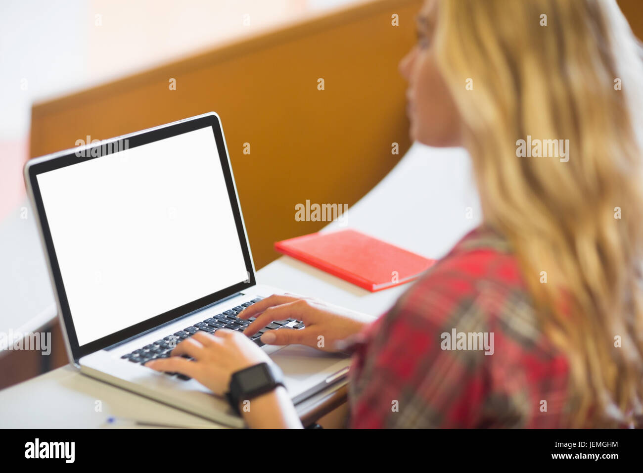 Attractive female student using laptop Stock Photo - Alamy