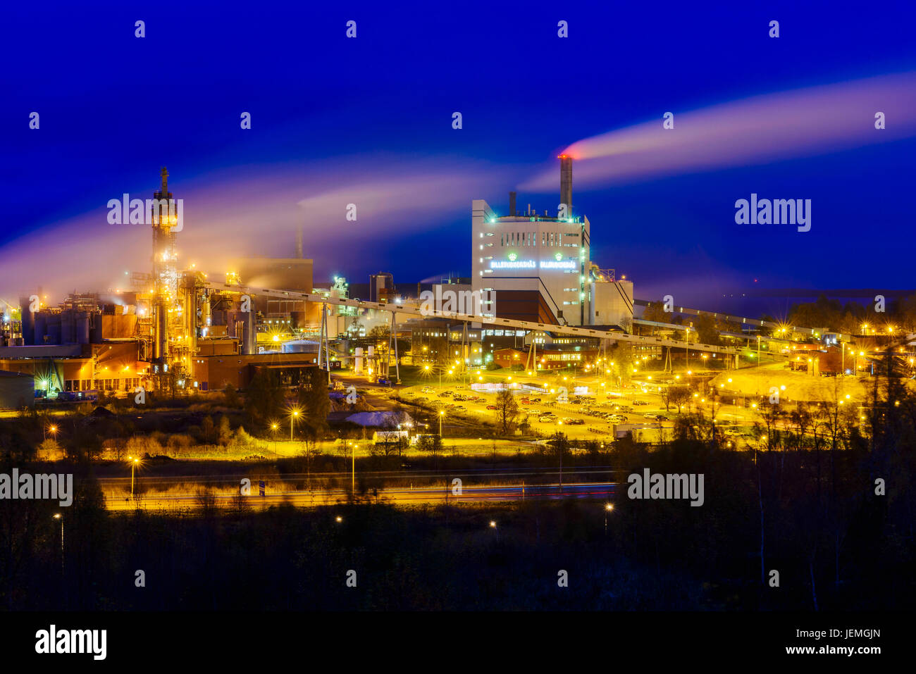 Illuminated factory at night Stock Photo - Alamy