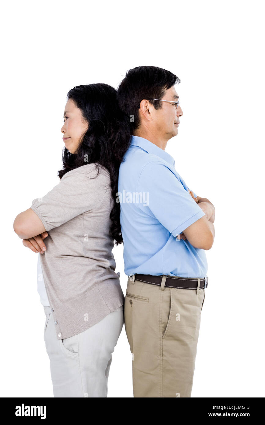 Couple with their backs to each other Stock Photo - Alamy