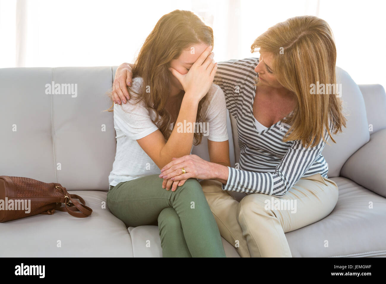 Mother comfort her daughter Stock Photo - Alamy