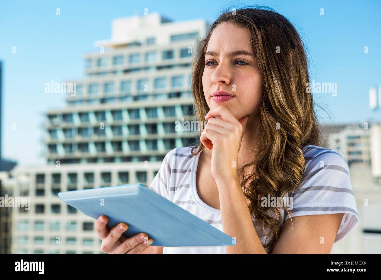 Young girl using her tablet Stock Photo - Alamy