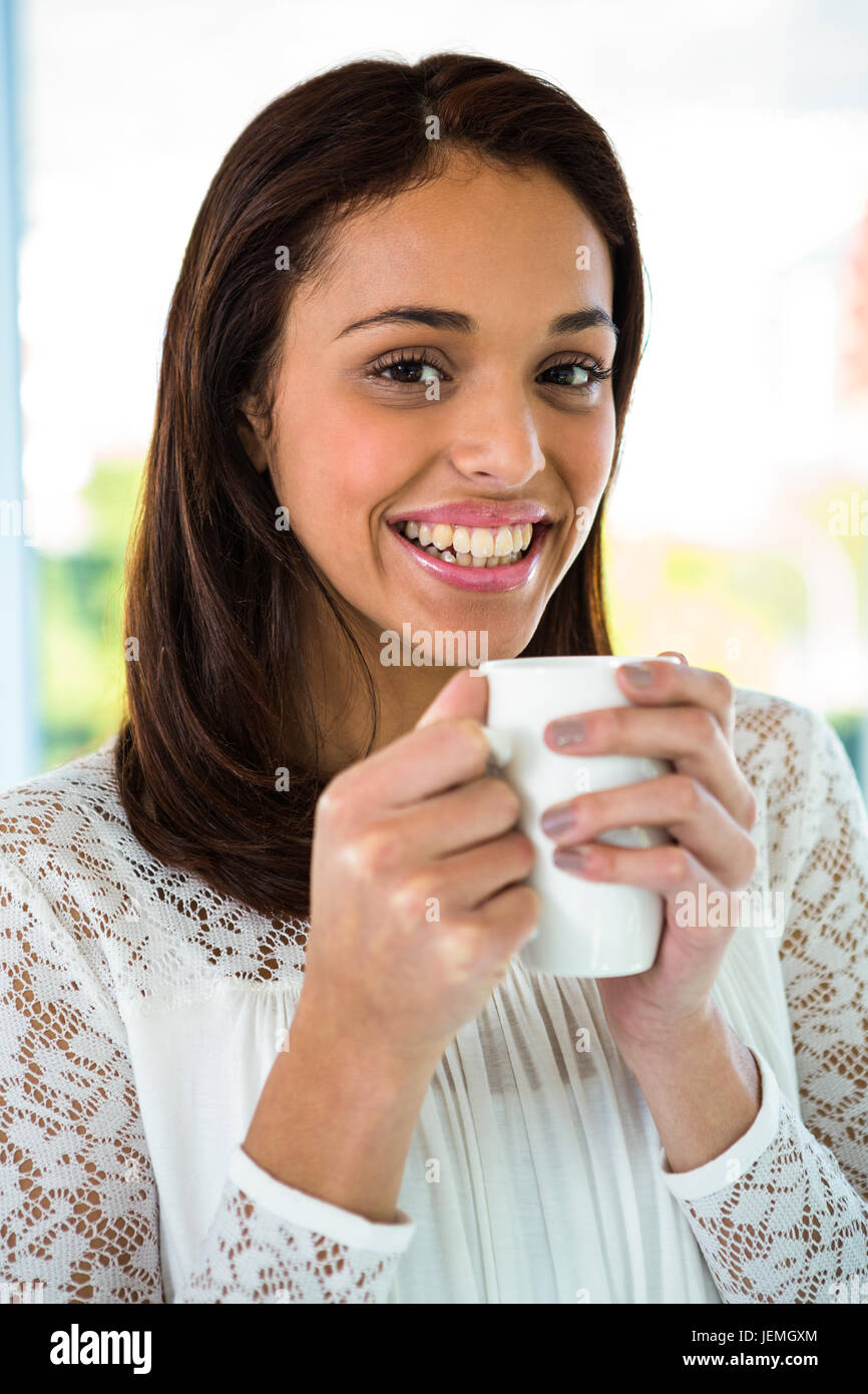 Young girl drink her tea Stock Photo - Alamy