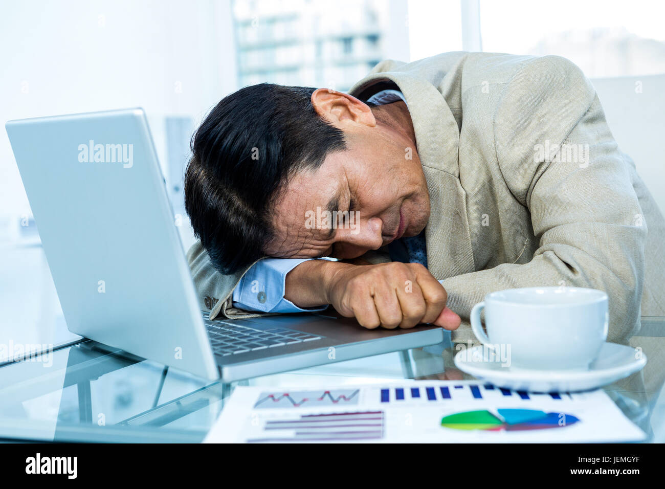 Tired asian businessman sleeping Stock Photo - Alamy