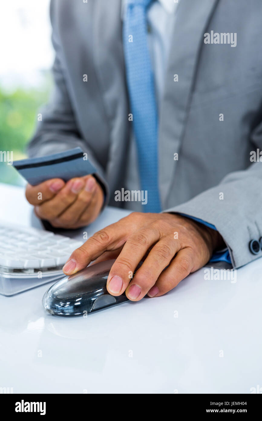 Businessman holding business card Stock Photo - Alamy Businessman holding business card Stock Photo - Alamy