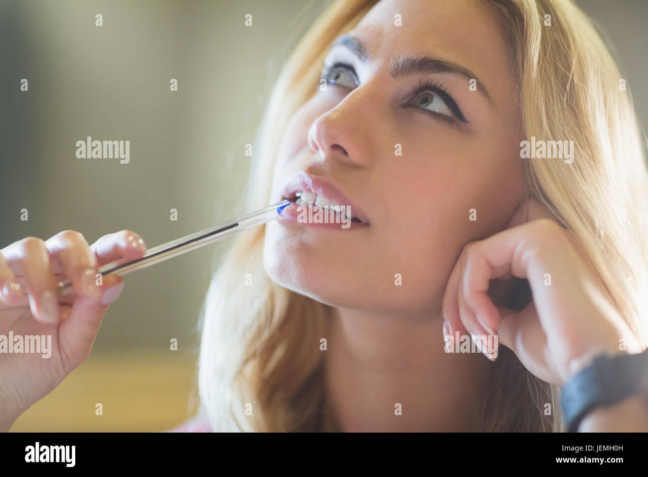 Thoughtful female student during class Stock Photo - Alamy