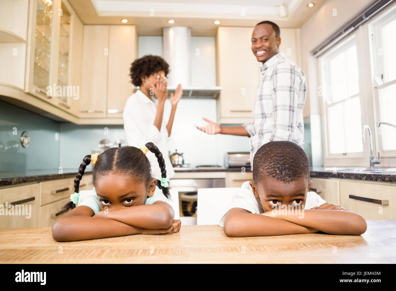 Sad siblings against parents arguing Stock Photo - Alamy
