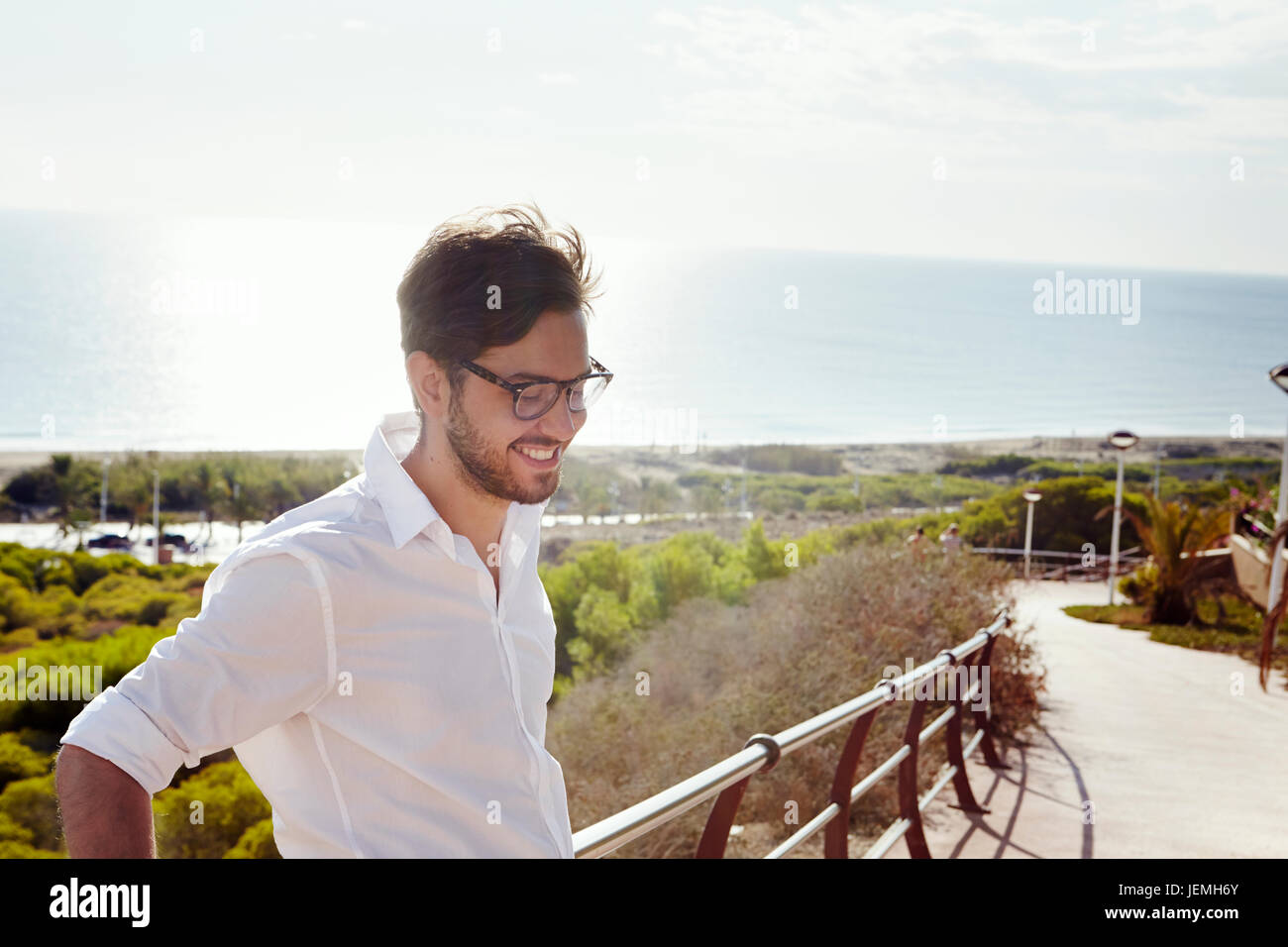 Man looking over fence hi-res stock photography and images - Alamy