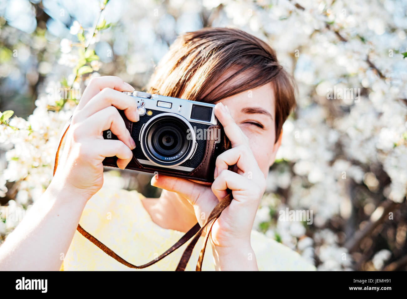 Young woman taking picture Stock Photo - Alamy