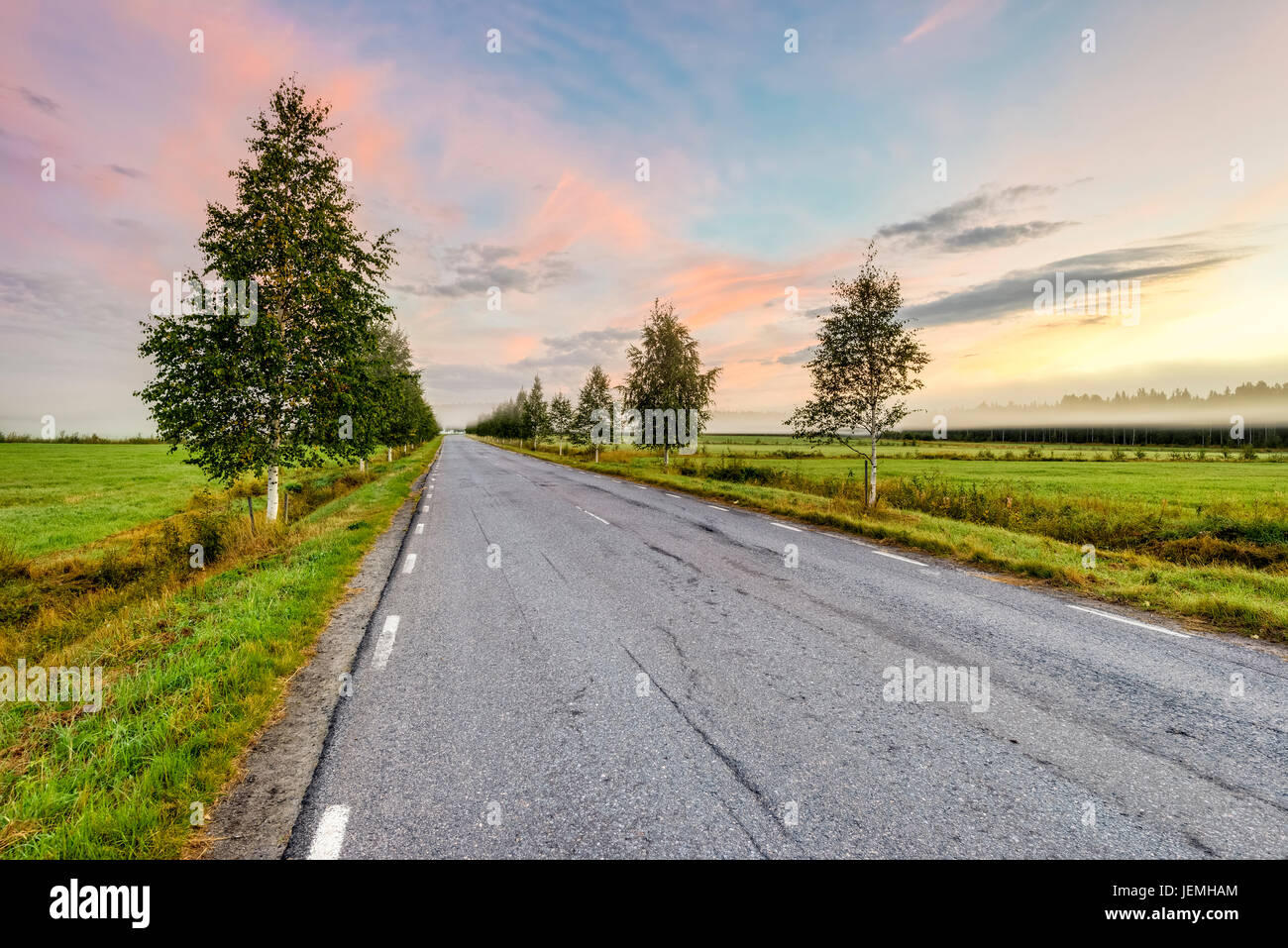 Country road at dusk Stock Photo - Alamy