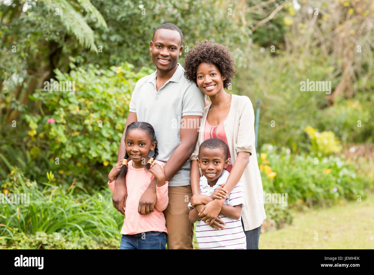 Happy family standing outside together Stock Photo - Alamy