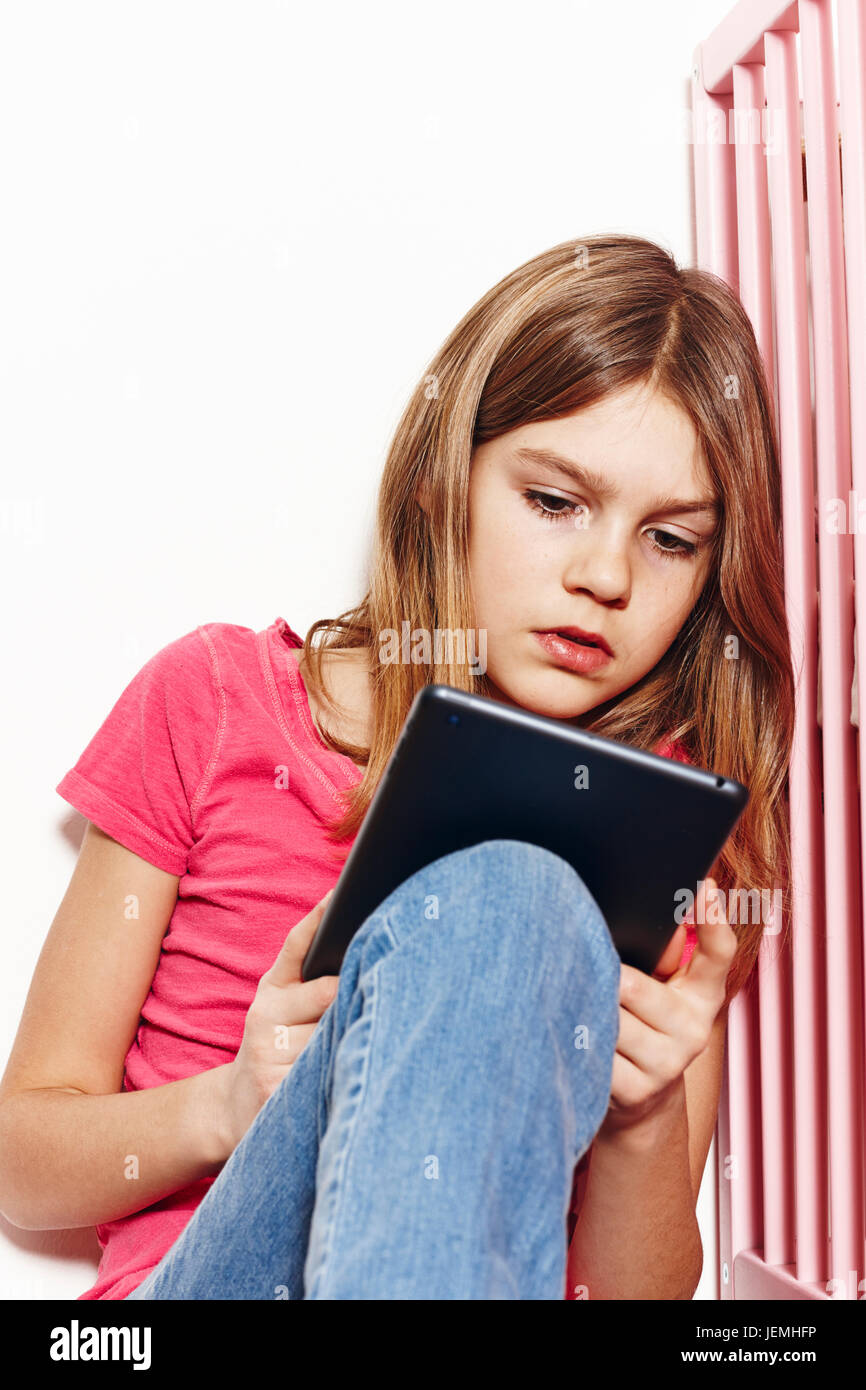 Girl using tablet Stock Photo - Alamy