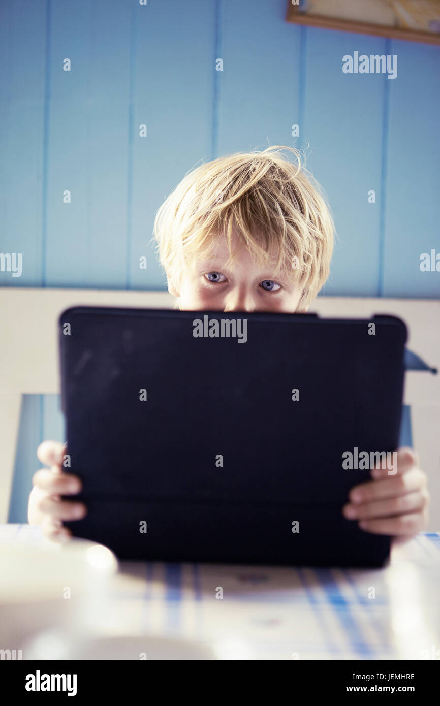 Boy using digital tablet Stock Photo - Alamy