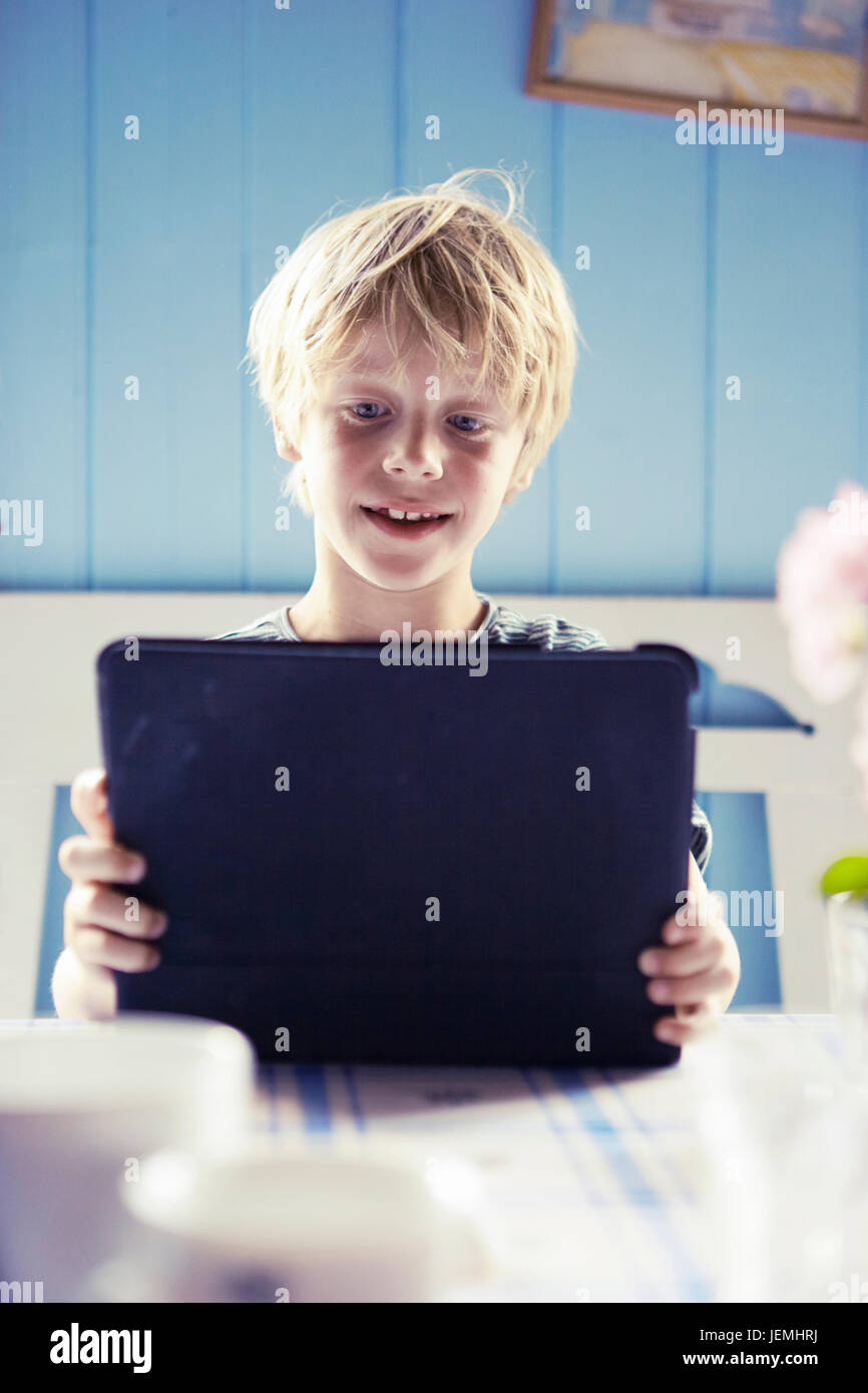 Boy using digital tablet Stock Photo - Alamy