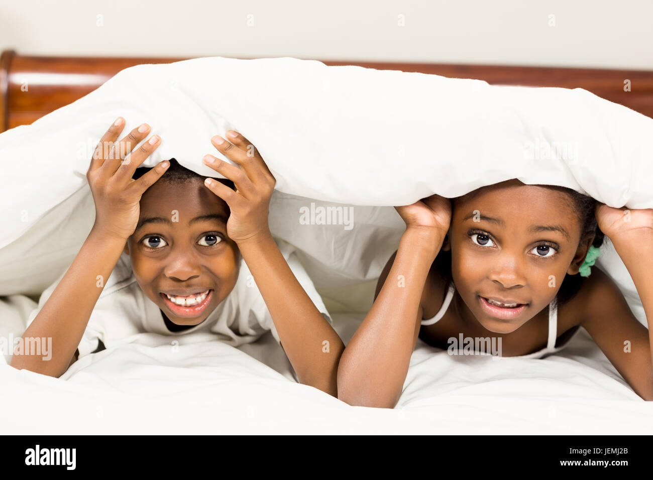 Brother and sister lying in the bed Stock Photo - Alamy