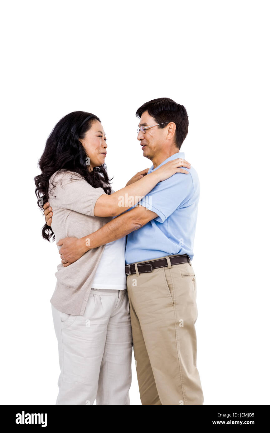 Smiling couple holding each other Stock Photo - Alamy