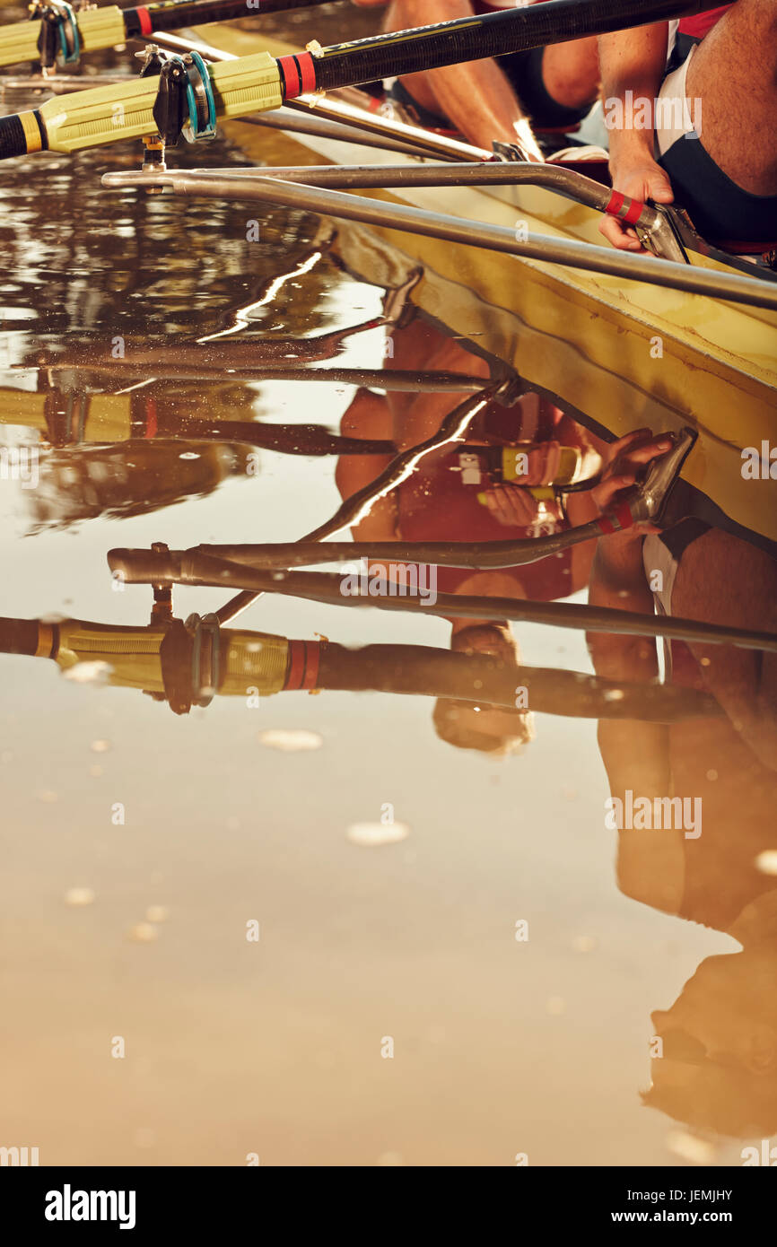 Men canoeing, reflection in water Stock Photo - Alamy