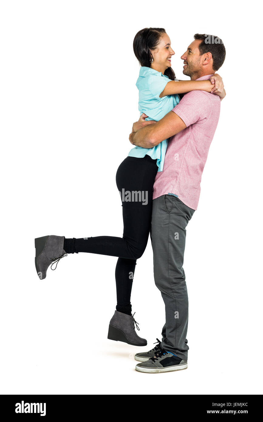 Cheerful young couple hugging Cut Out Stock Images & Pictures - Alamy