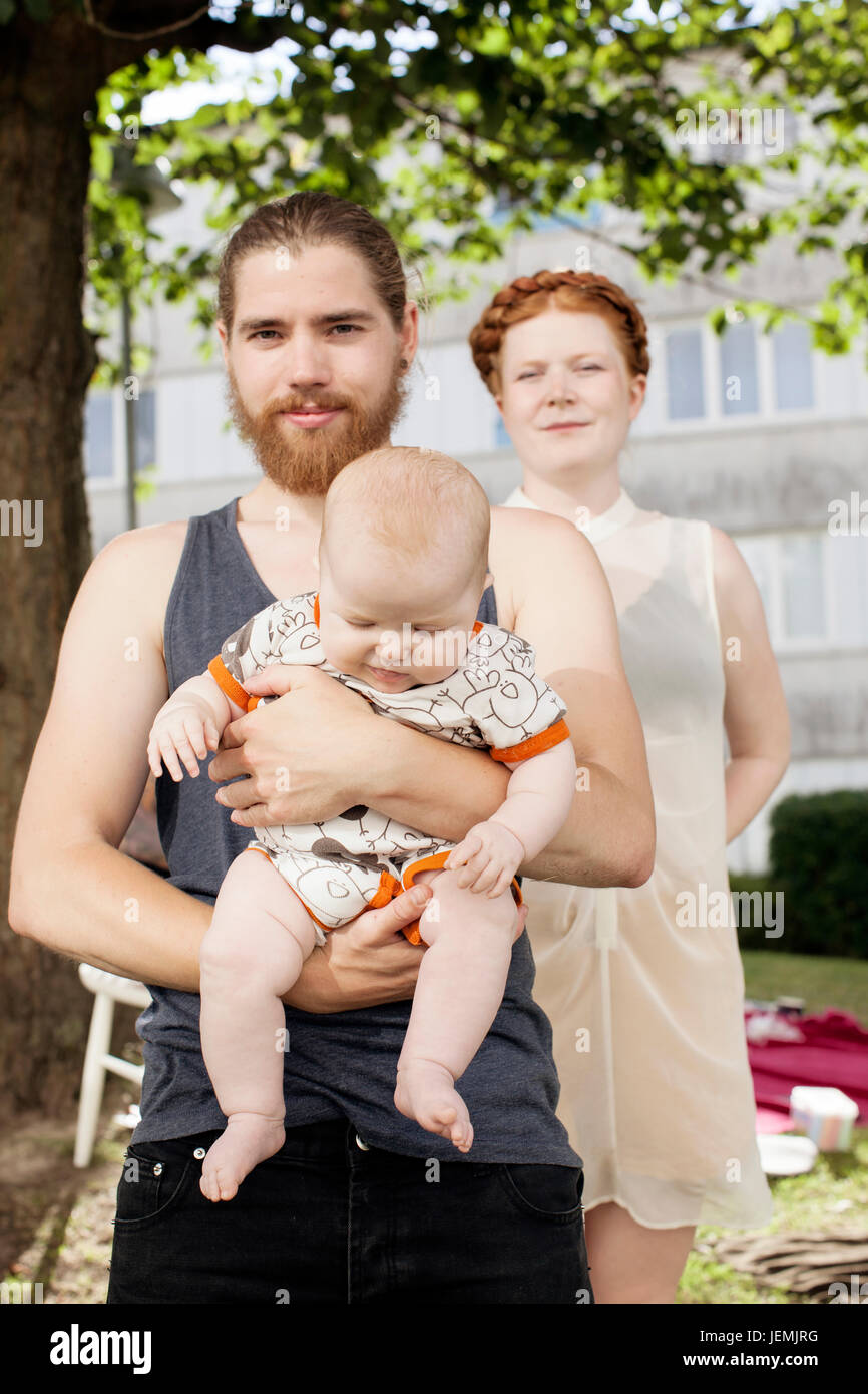 Young parents with baby Stock Photo - Alamy
