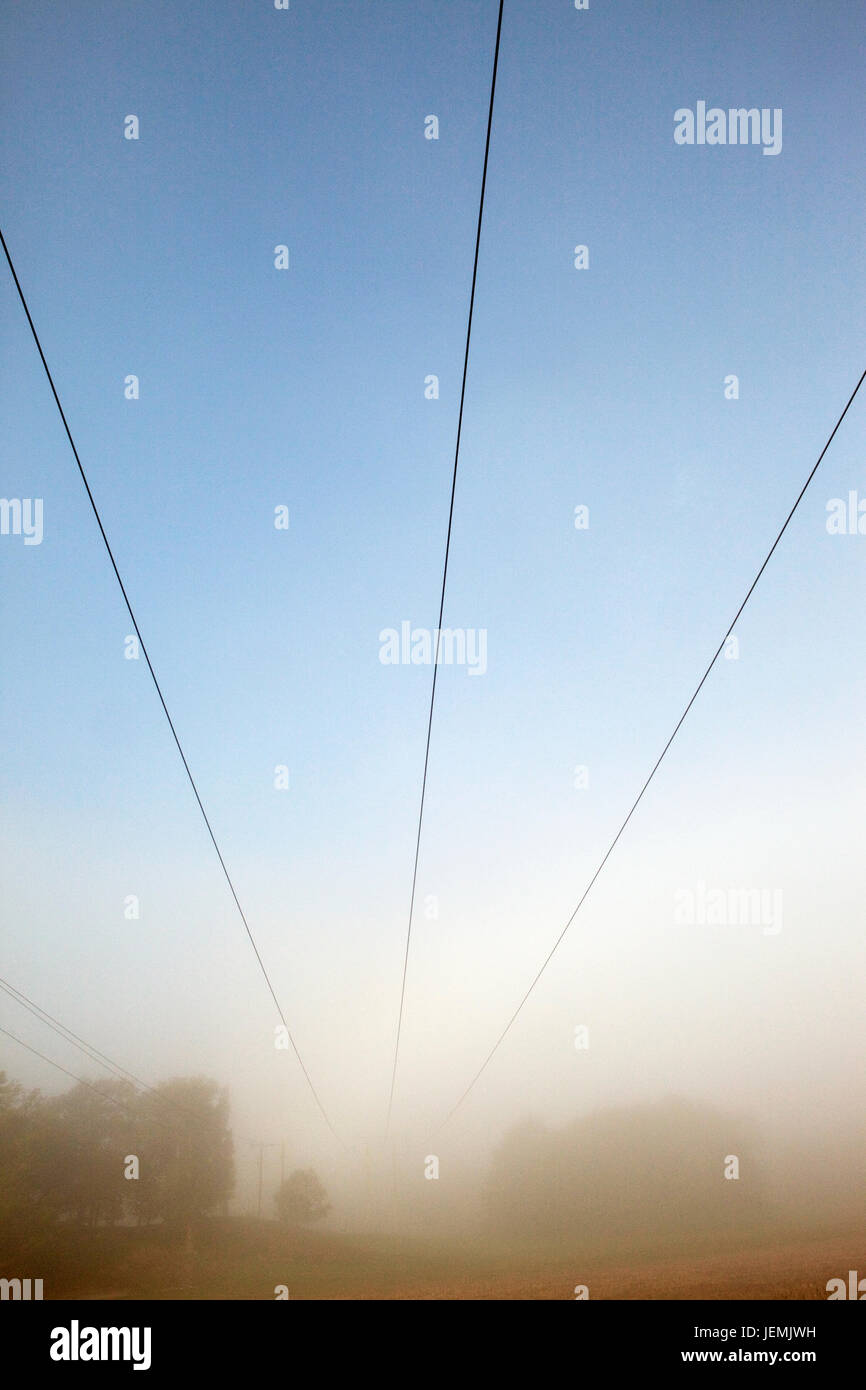 Power line in fog Stock Photo - Alamy