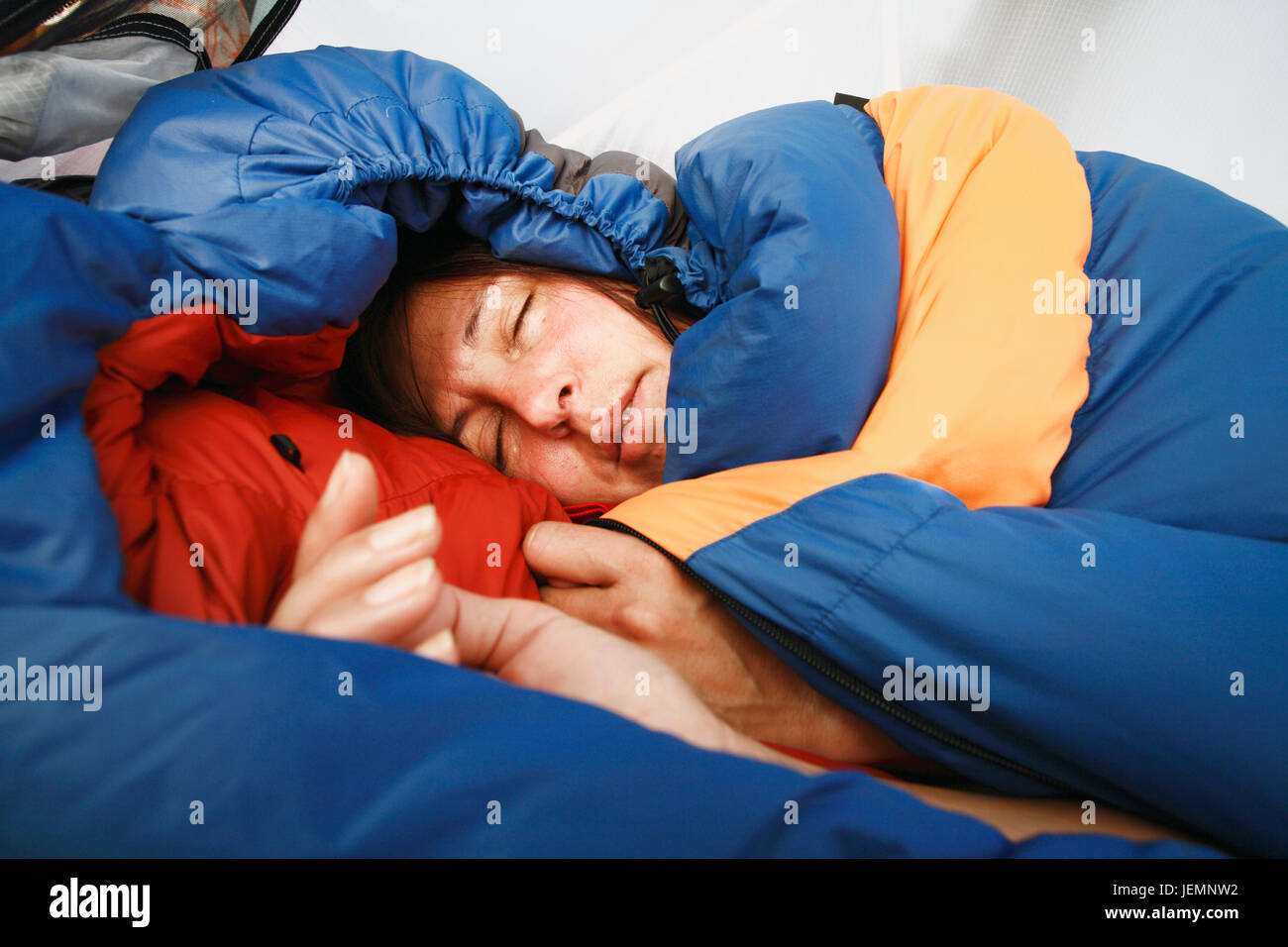 Woman sleeping in sleeping bag Stock Photo - Alamy