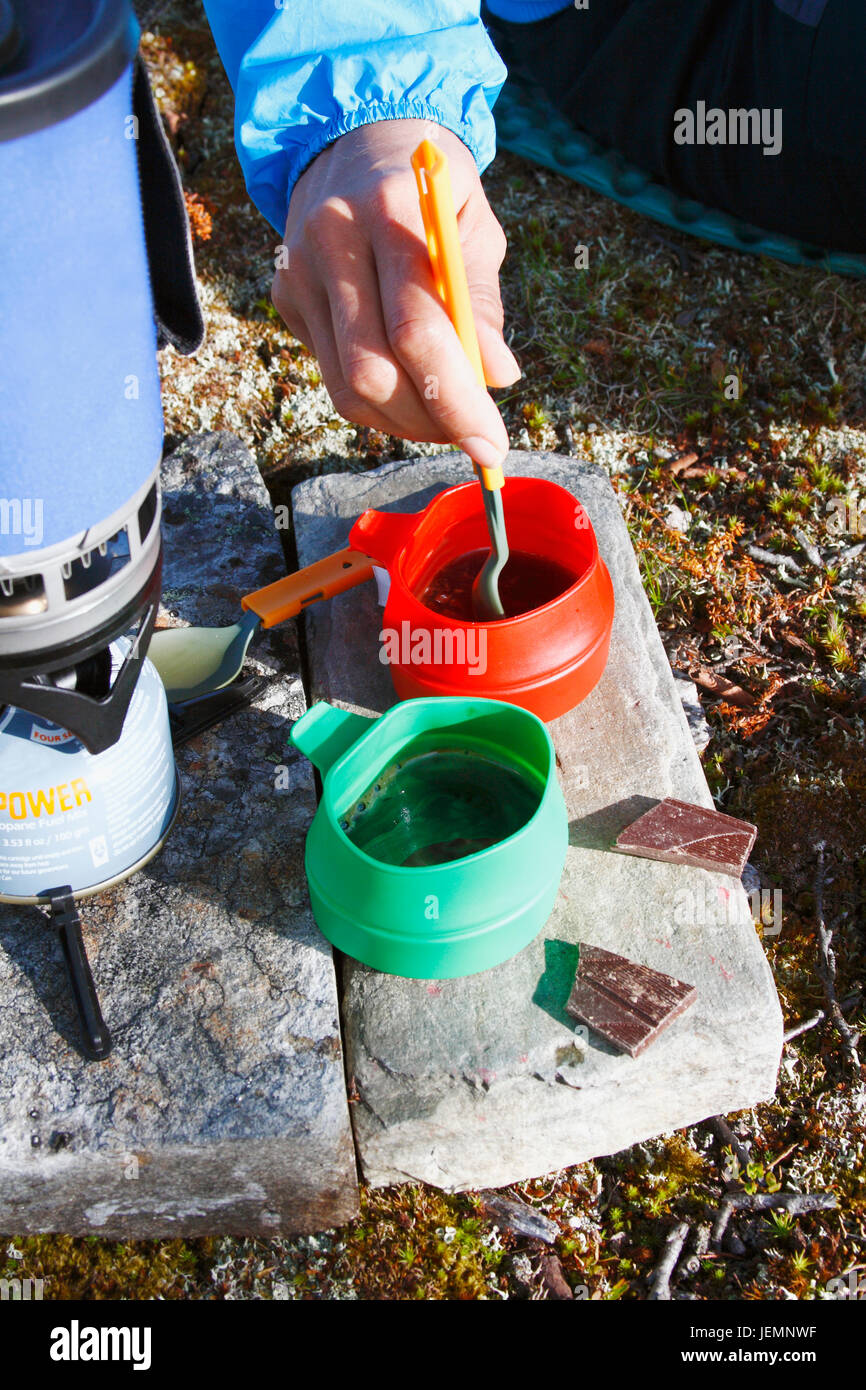 Hand stirring coffee Stock Photo - Alamy