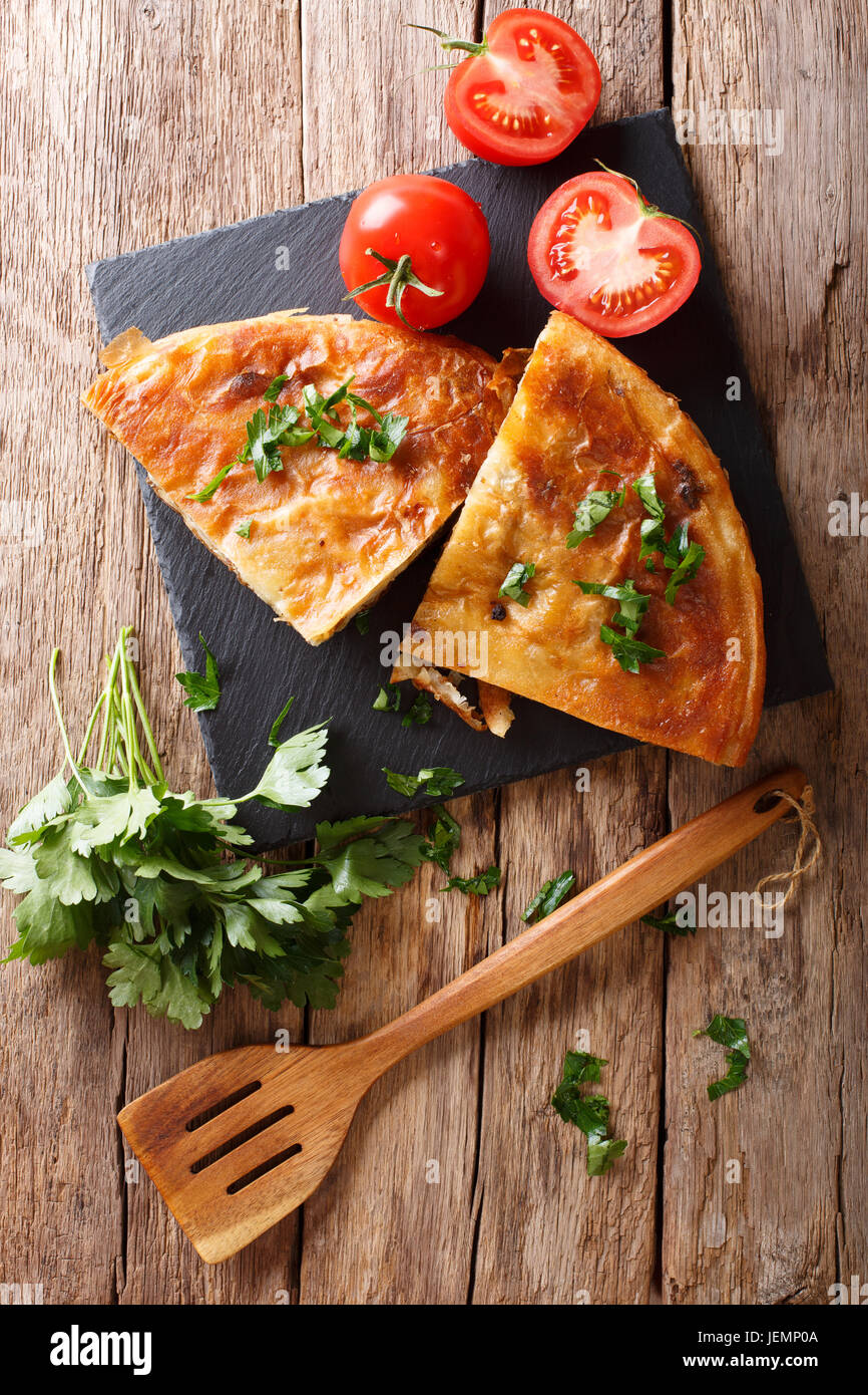 Tasty Turkish burek with meat close-up on table. vertical view from ...