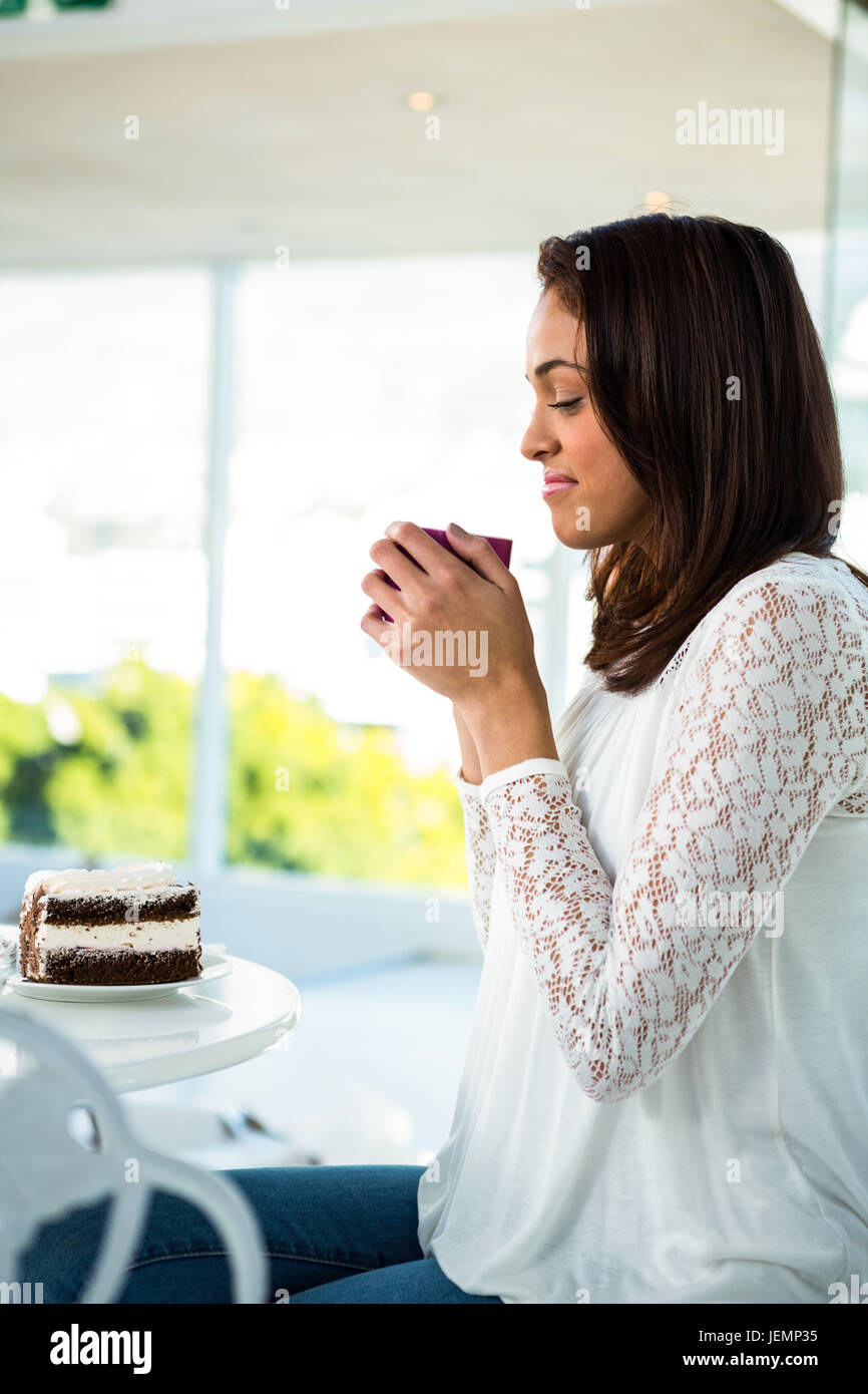 Young girl drink her tea Stock Photo - Alamy
