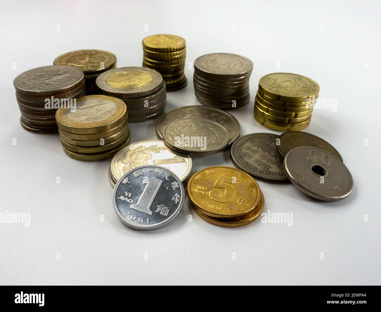 Stack of various coin types on white background as financial concepts ...