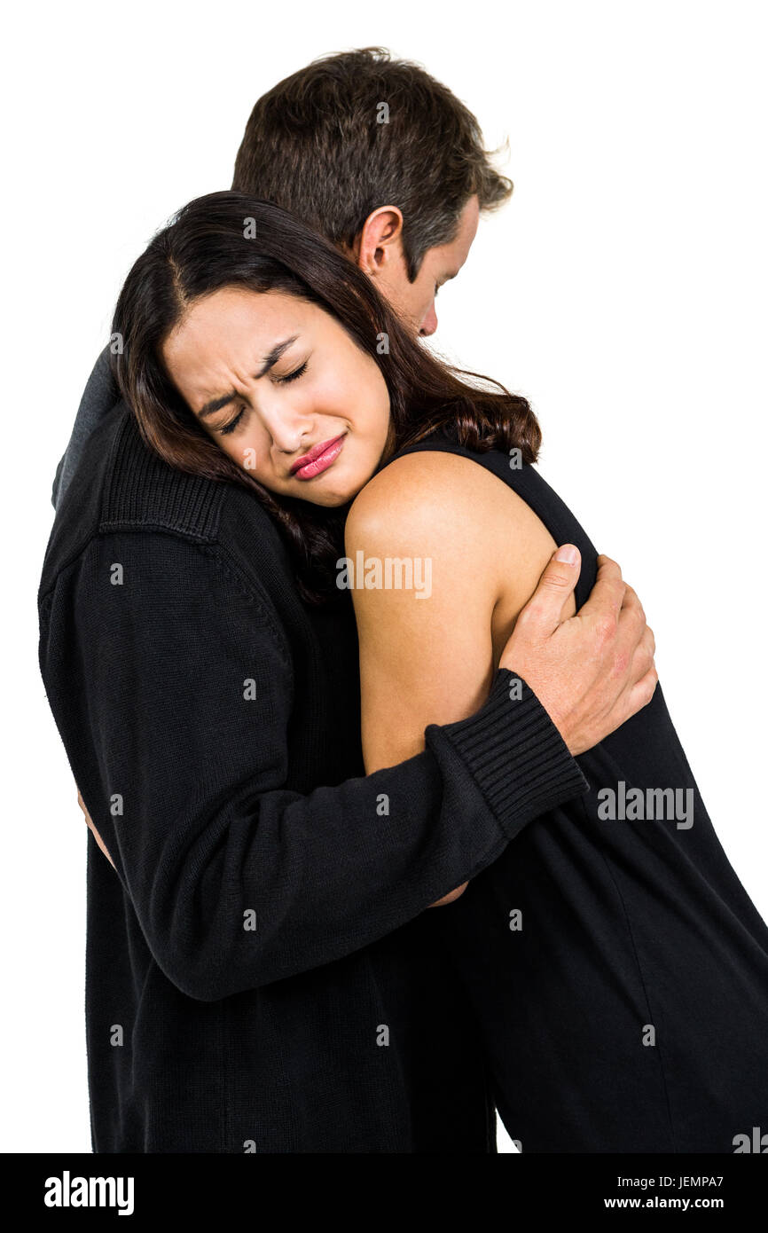 Unhappy couple embracing Stock Photo - Alamy