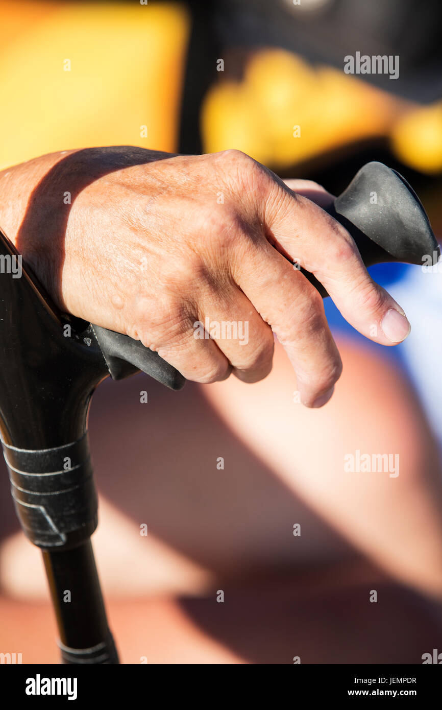 Hand on crutch Stock Photo - Alamy