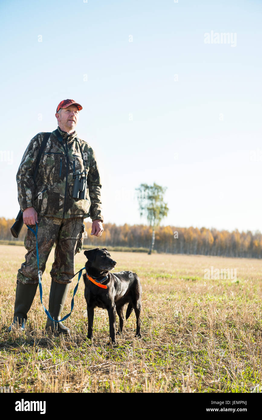 Man hunting with dog Stock Photo - Alamy