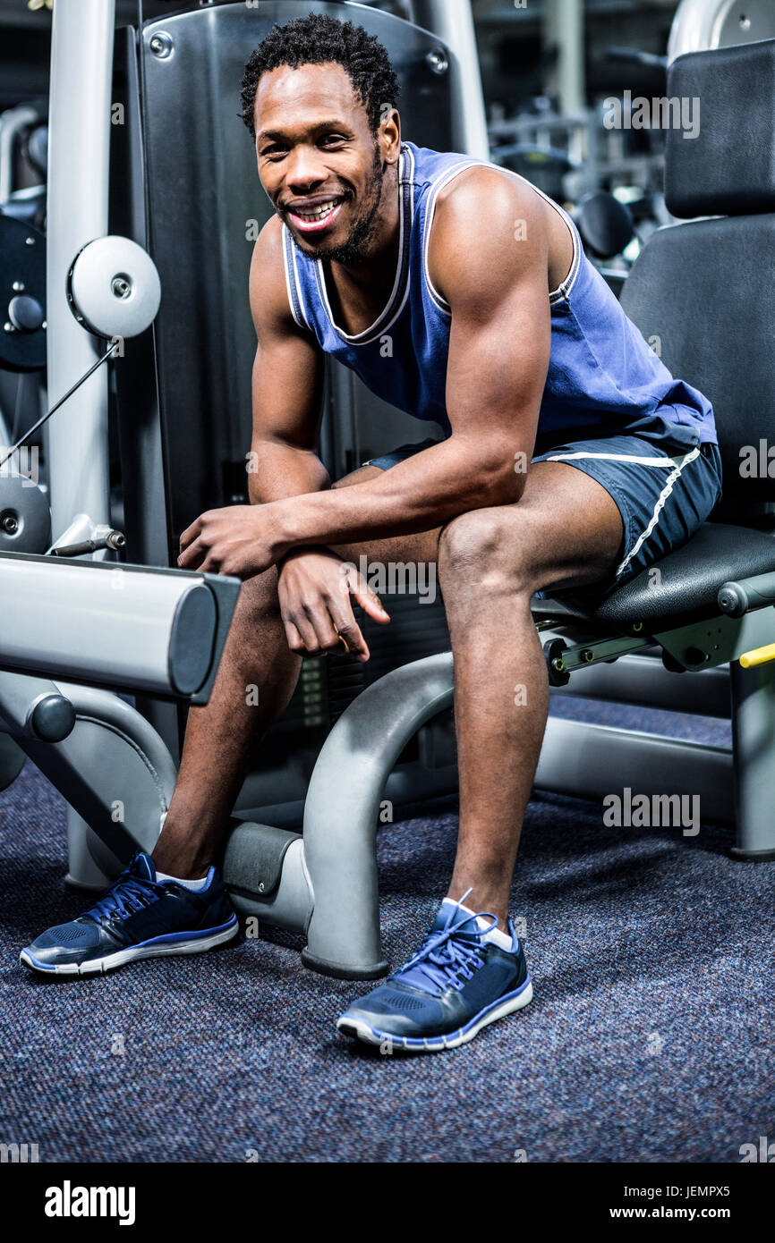 Smiling muscular man posing for camera Stock Photo - Alamy