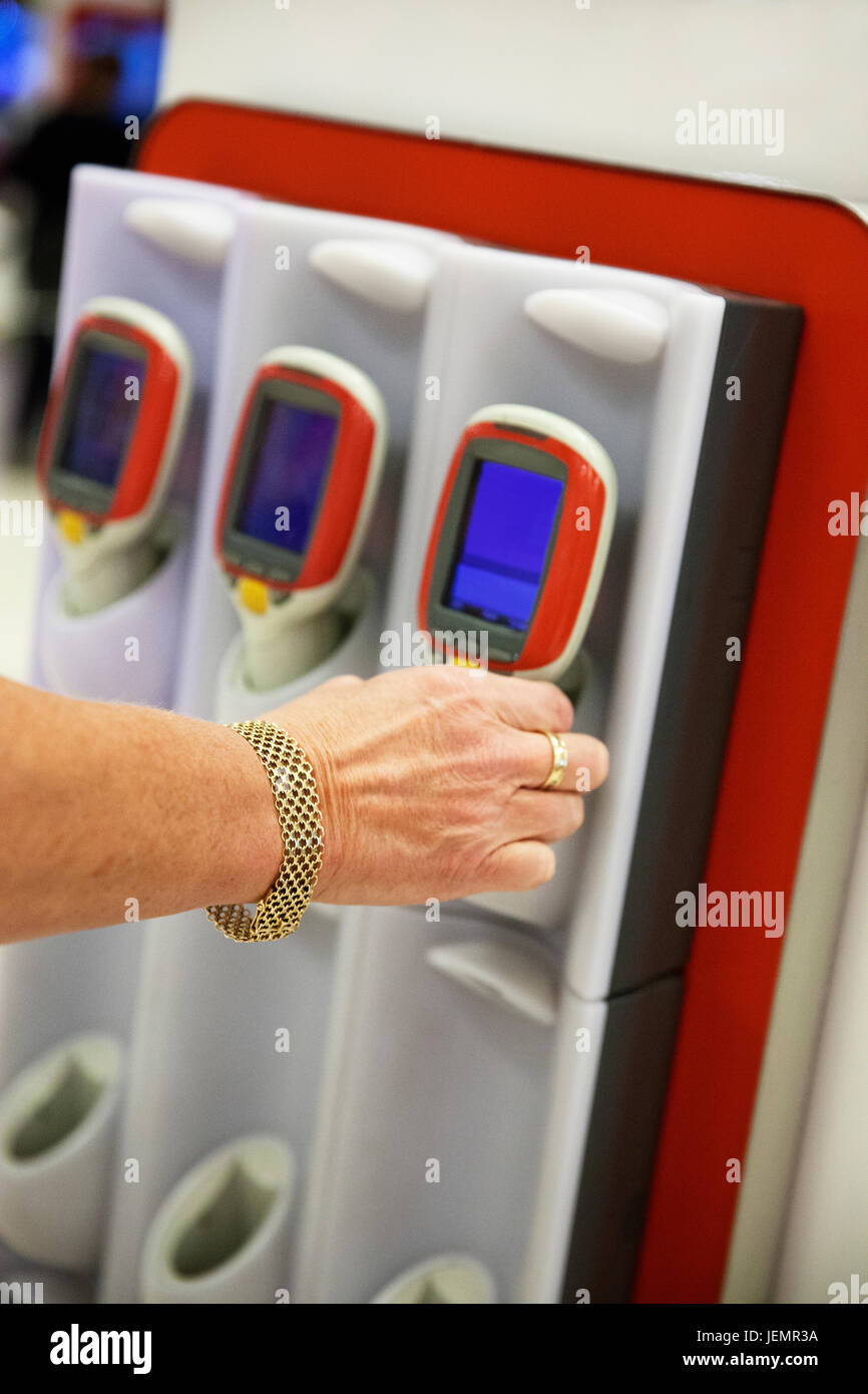 Hand holding barcode reader Stock Photo - Alamy