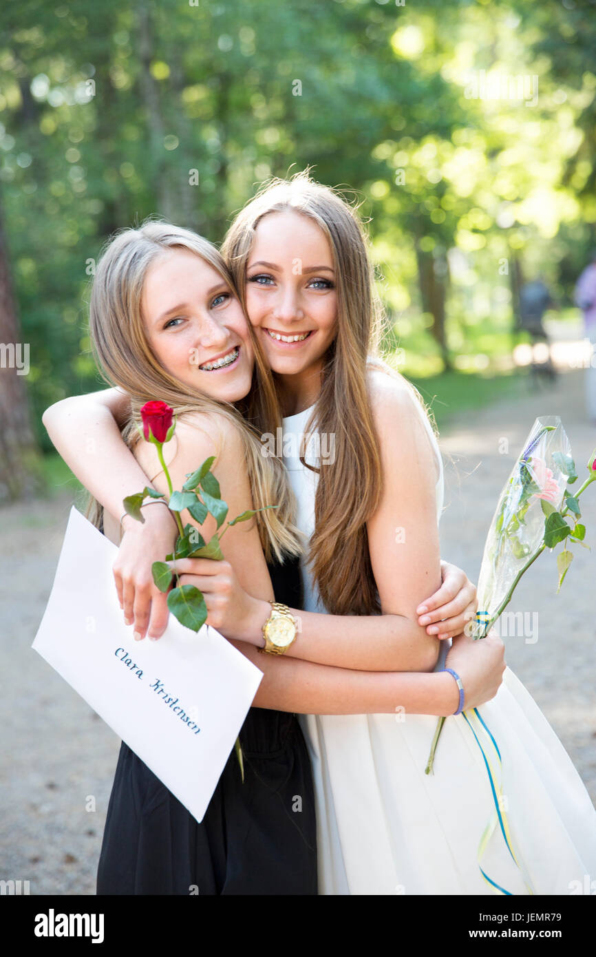 Teenager girls hugging Stock Photo - Alamy