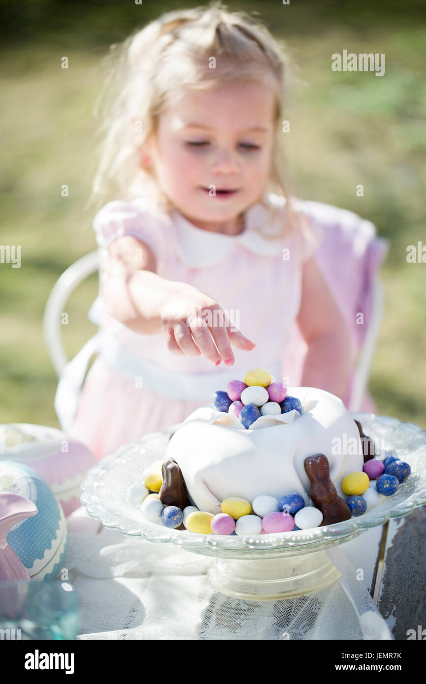 Reaching for cake hi-res stock photography and images - Alamy