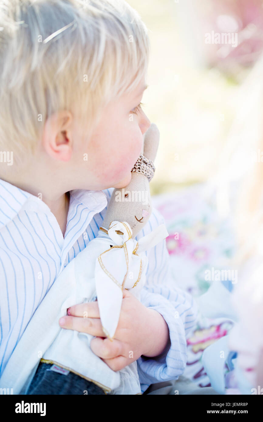 Boy with rabbit toy Stock Photo - Alamy