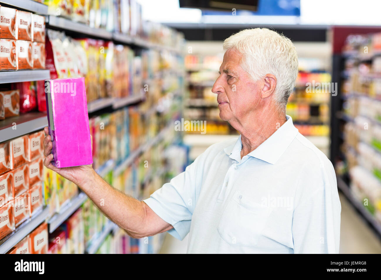 Senior man holding pink box Stock Photo - Alamy