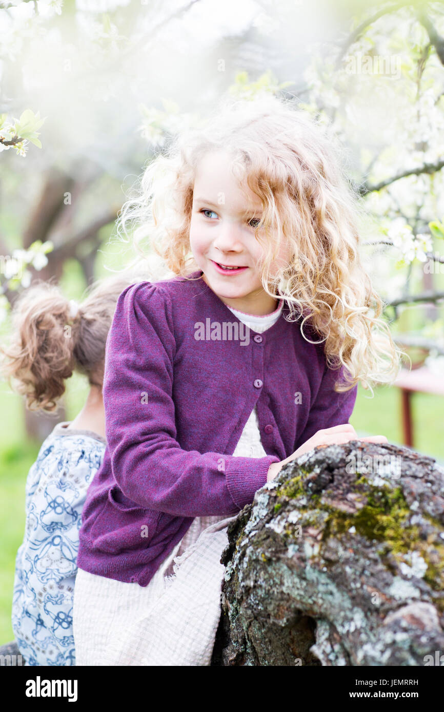 Girls near tree Stock Photo - Alamy