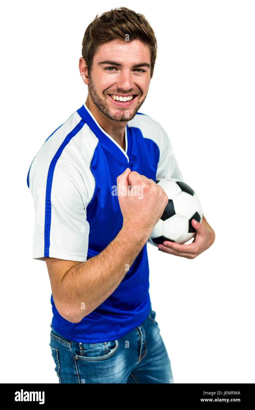 Portrait of handsome man holding football Stock Photo - Alamy