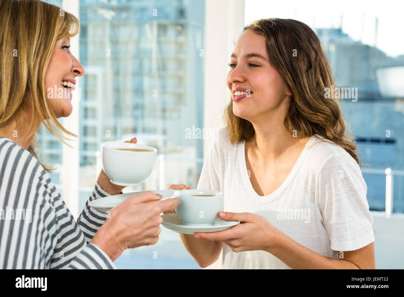 Mother and daughter having tea Stock Photo - Alamy