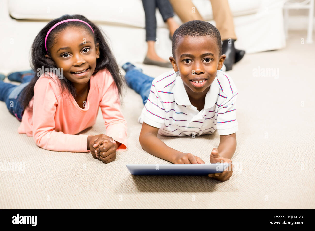 Happy kids using tablet pc Stock Photo - Alamy