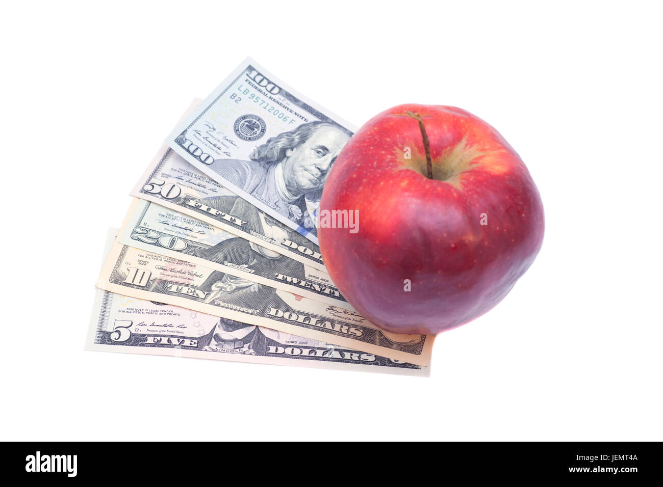 Apple and dollars isolated on a white background Stock Photo - Alamy