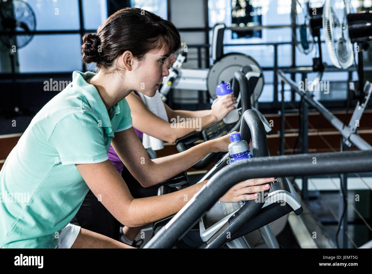 Adult female using gym bike hi-res stock photography and images - Alamy