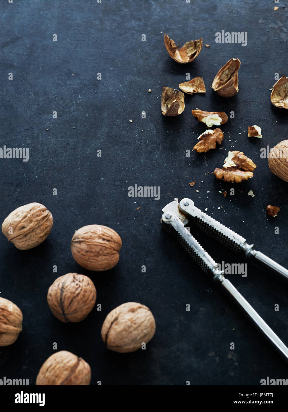 Bird crows eating nuts hi-res stock photography and images - Alamy