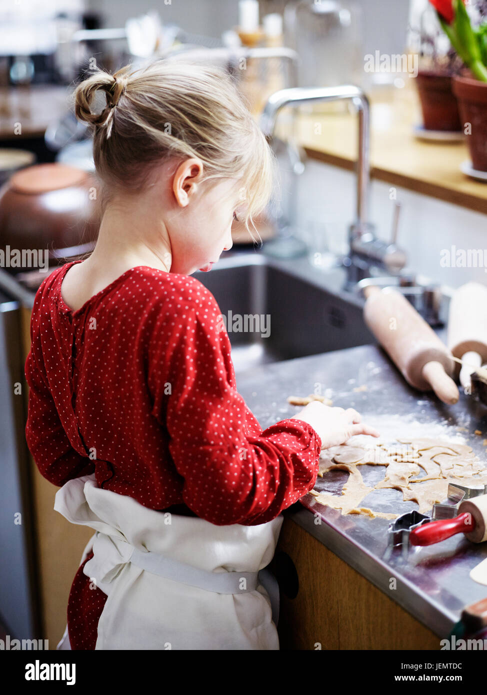 Girl making cookies Stock Photo - Alamy