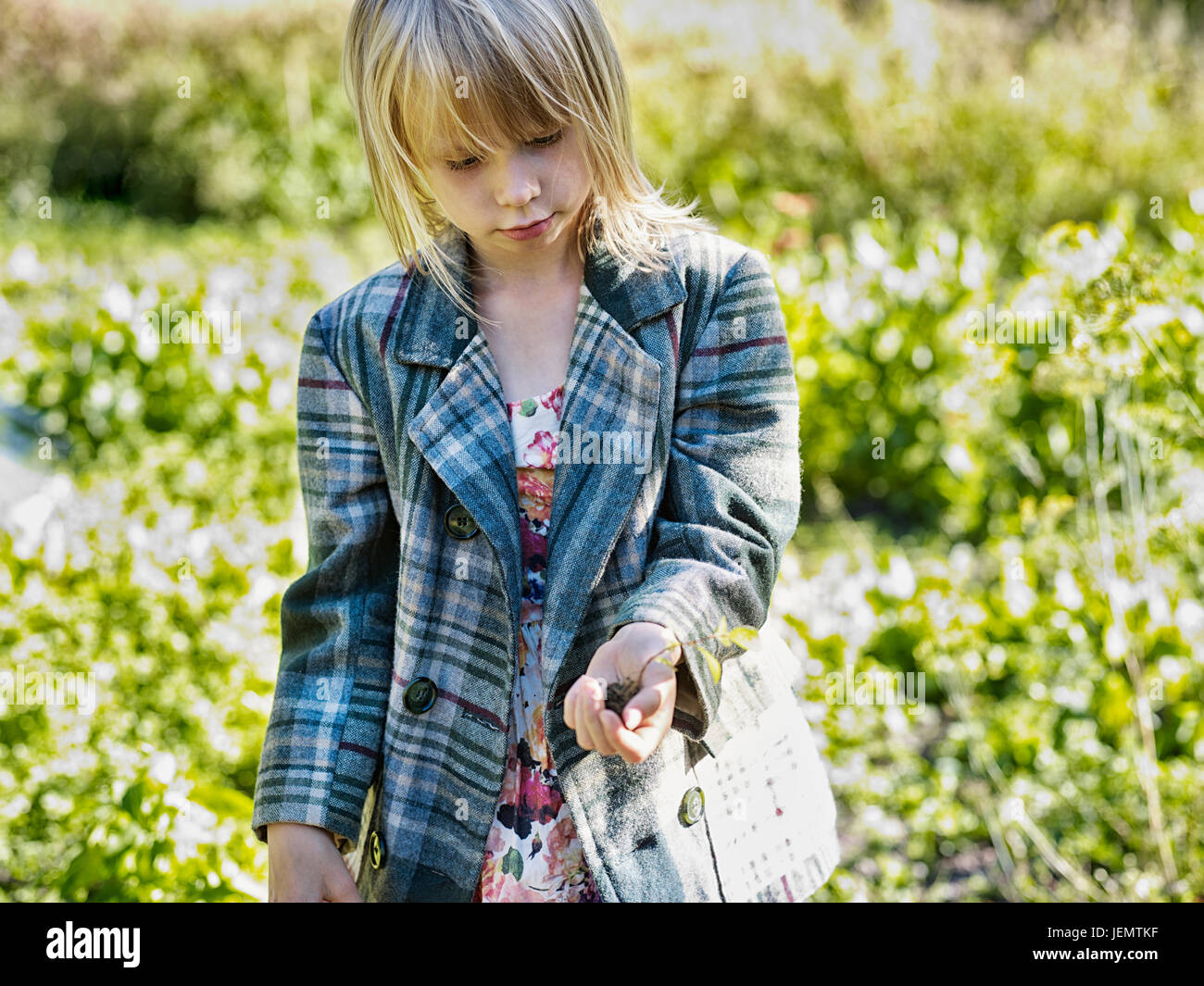 Girl wearing checked coat Stock Photo - Alamy
