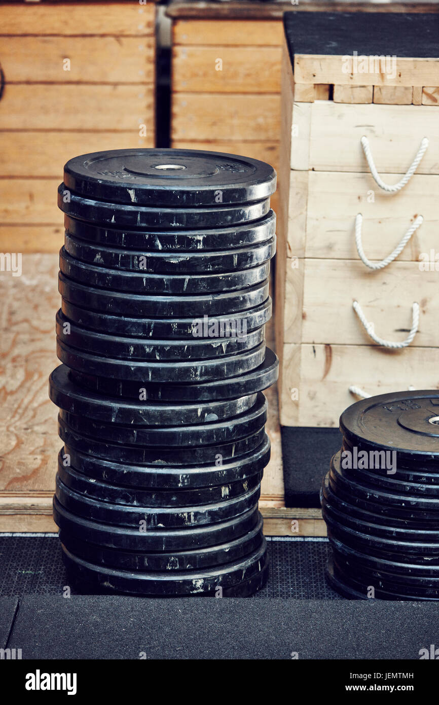 Stack of weights in gym Stock Photo - Alamy