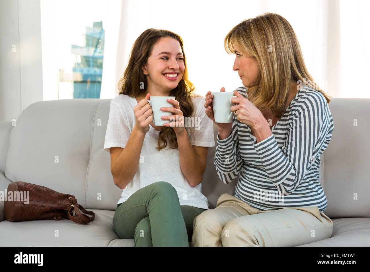 Happy mother daughter drinking tea hi-res stock photography and images ...